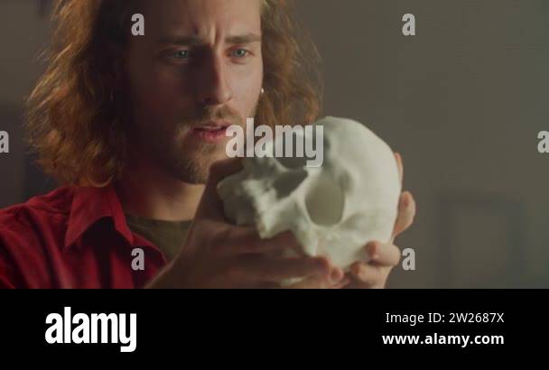 Close up view of millennial handsome sculptor creating art object ...