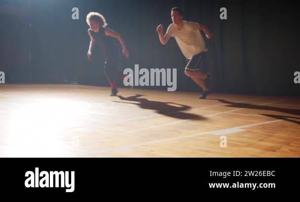 Two young boys basketball players shuttle race banquet hall evening ...