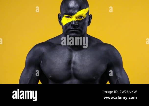 Man sports fan celebrates team victory. Bodybuilder athlete with yellow ...