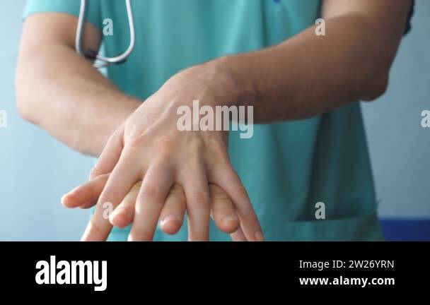 Doctor applies disinfectant on his hands. Medic inflicted on arm ...