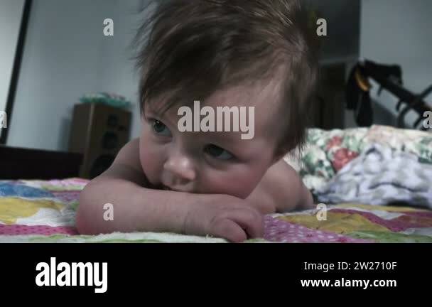 Baby turning head to look at the action Stock Video Footage - Alamy