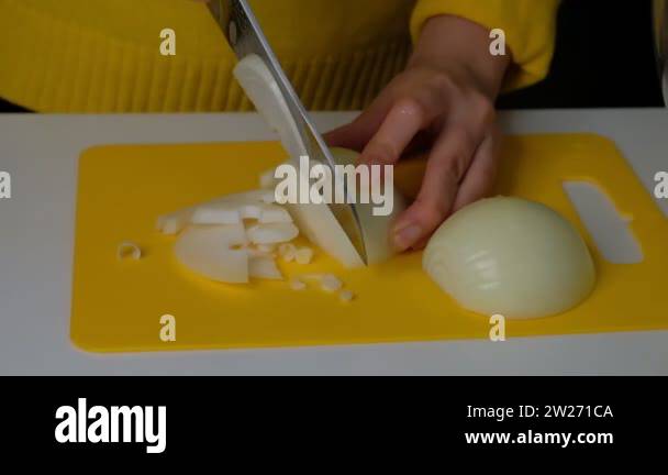 chef slices the onion. Knife, cutting onion. Quick cutting of ...