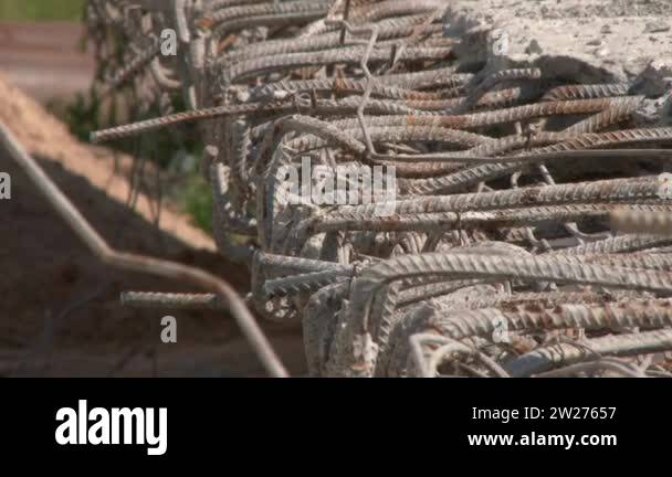 Close-up of metal bars destroyed after an explosion or earthquake ...