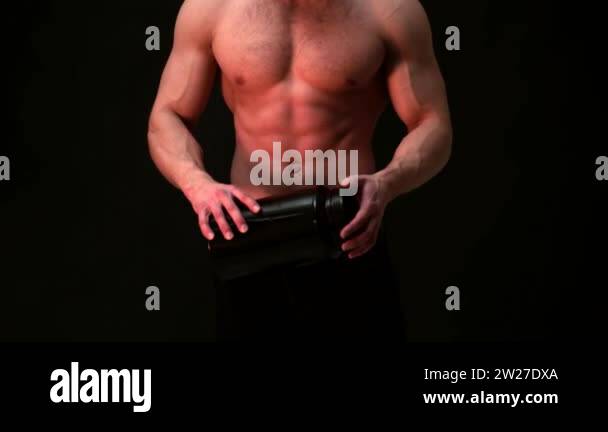 Muscular shirtless male model showing sport nutrition, protein. Sports ...