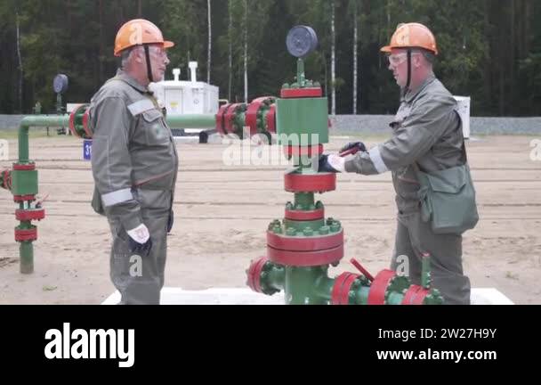 Man oil engineer overseeing Cross type X-mass tree destined for ...