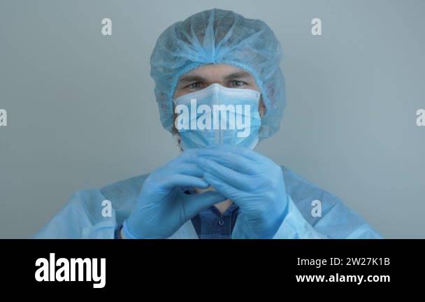 Laborant carefully preparing syringe for injection. Male holding tube ...