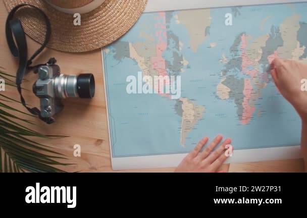 Horizontal zoom-out top-view flat lay panning of unrecognizable female ...