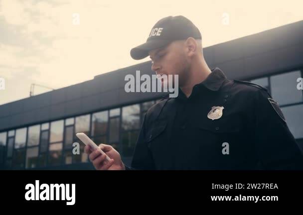 Policeman using mobile device Stock Videos & Footage - HD and 4K Video ...