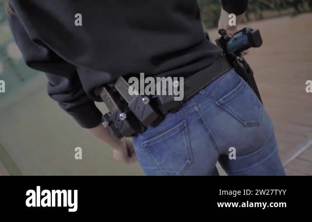 Girl gun belt Stock Videos & Footage - HD and 4K Video Clips - Alamy