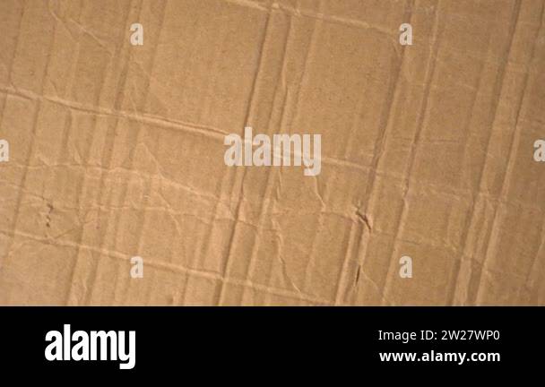Wrinkled cardboard texture close up, paper packaging background ...