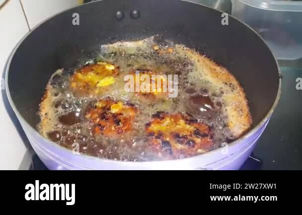 Chapli Kebab frying in the oil, a closeup view. Chapli kabab are ...