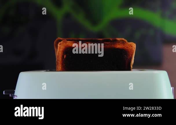 Burnt bread in a toaster. Highly toasted bread in a toaster Stock Video ...