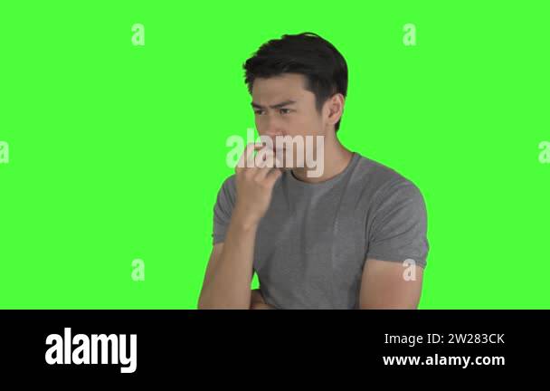 Young man thinking something while getting an idea in the studio. Shot ...