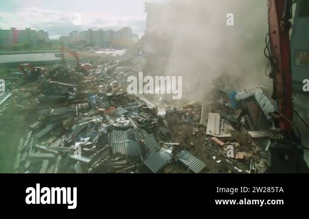 demolition site of destroyed sports stadium with excavator Stock Video ...