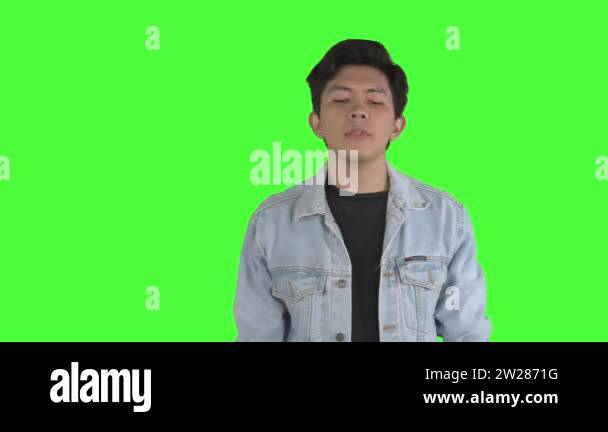 Shocked young man having heart attack while standing in the studio ...