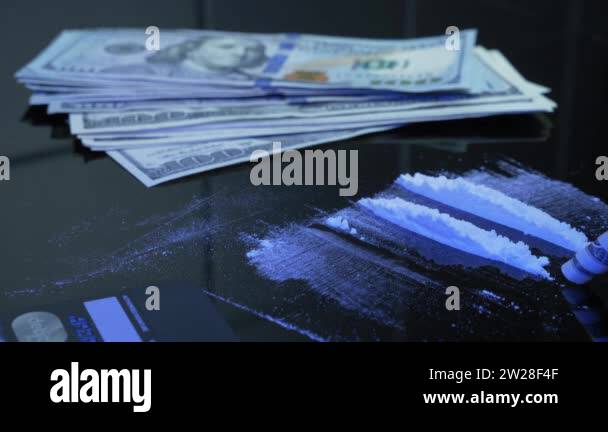 Drug, cocaine, money concept. Unrecognized person is snorting line of ...