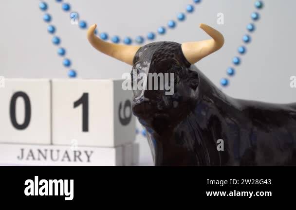 bull and the calendar. Handmade wood cube with date month and day ...