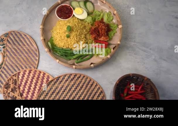 close-up footage of Turmeric rice with curry or nasi kunyit kuning ...