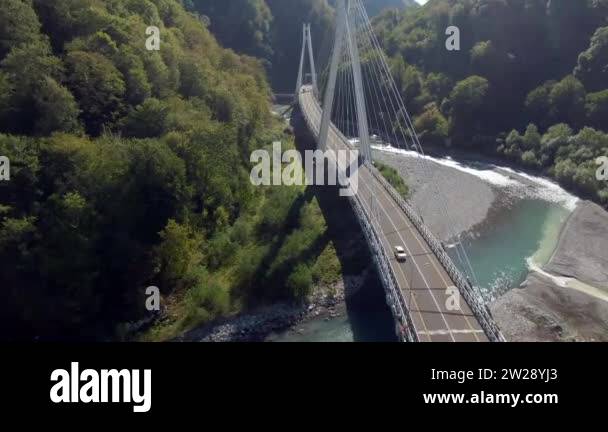 Flying over a high-speed highway in a mountain gorge above a stormy ...