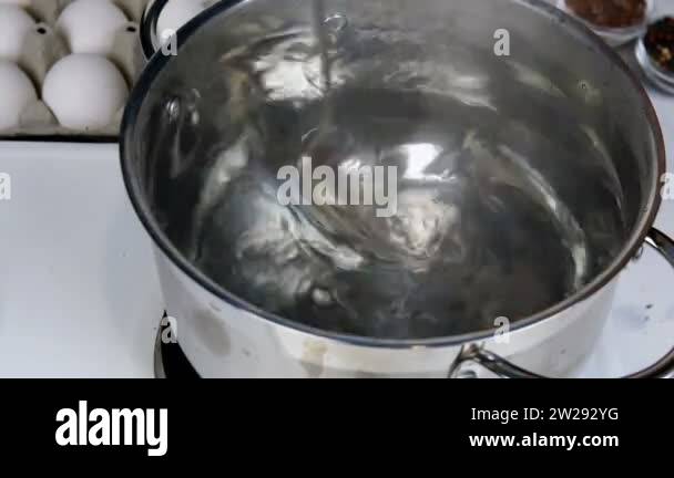 Recipe For Cooking Poached Eggs Raw Egg Is Placed In Boiling Water In Saucepan After Stirring
