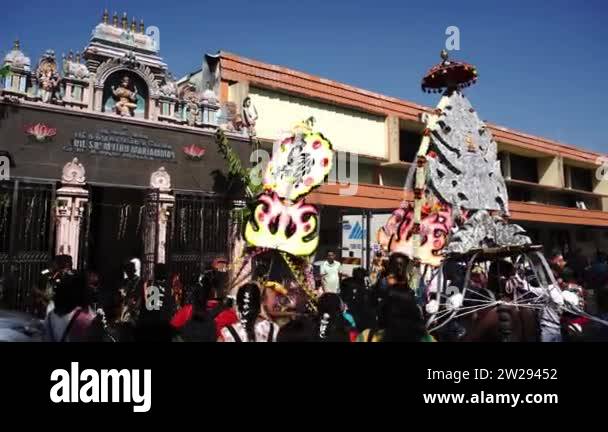 Hindu devotees in kavadi dance in front Hindu temple Stock Video ...