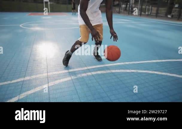 Low View of Young Afro American Athlete has Basketball Training ...