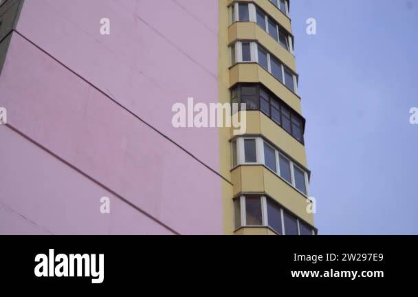 Part of the facade of the building with built-in balconies in it ...