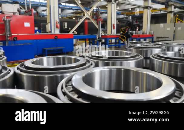 Industry and Machinery concept. Manufacture of bearings at plant. Ready ...