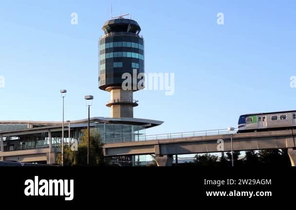 Skytrain commuter rail system at YVR airport station with airport ...