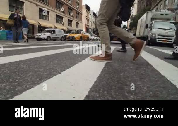 Low Angle Closeup of a Pedestrian's Shoes Crossing the Lexington Avenue ...
