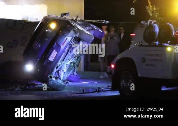 Tow truck flipping a car over Stock Video Footage - Alamy