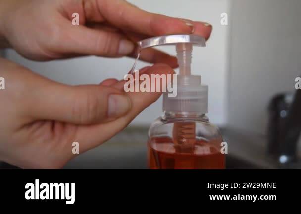 Female caucasian hands using hand sanitizer gel pump dispenser, hygiene ...