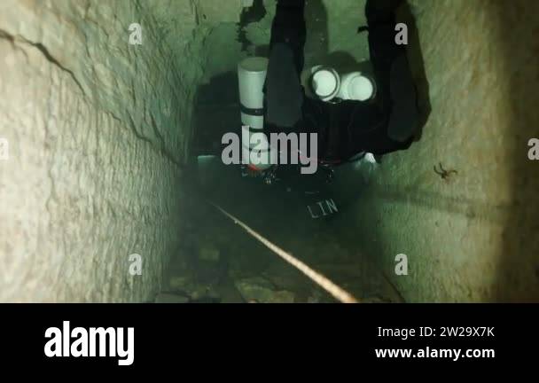 Technical diver in red flippers in the underwater cave of Budapest Stock Video Footage - Alamy