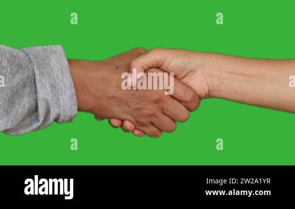 handshake of two people in front of green screen background Stock Video ...