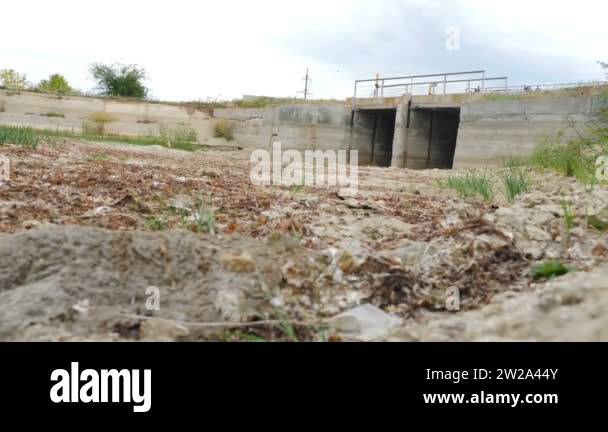 Ecological disaster. cracked soil ground and empty bridge over dried ...