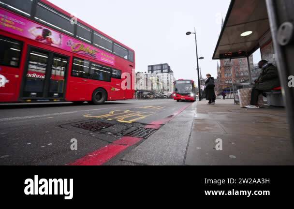 People wait to board buses at kings cross station Stock Videos ...
