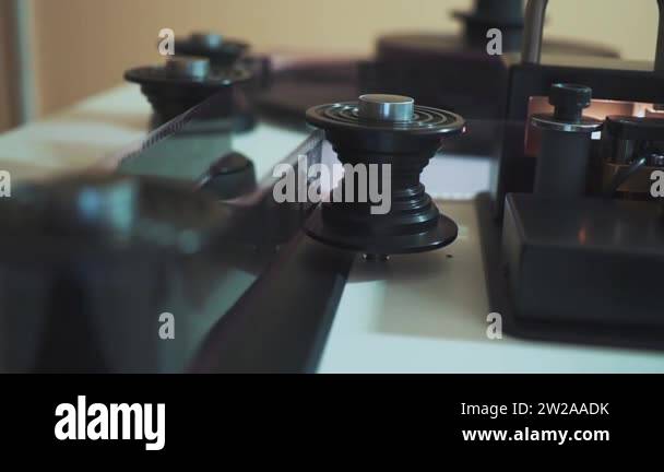 Old movie film strip. scanner is scanning 35 mm film to digital close ...