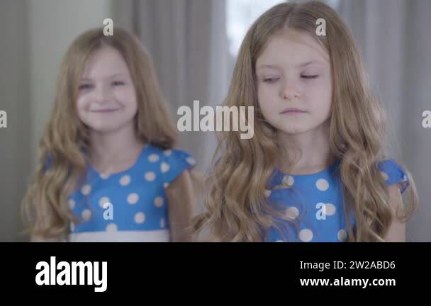 Blurred joyful Caucasian girl laughing and waving hand in front of ...