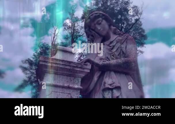 Figure of a praying angel. A very ancient stone statue. . Sad angel as ...