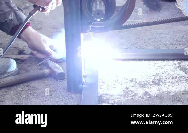 Electroplating of metal structures. The worker welds metal and a metal ...