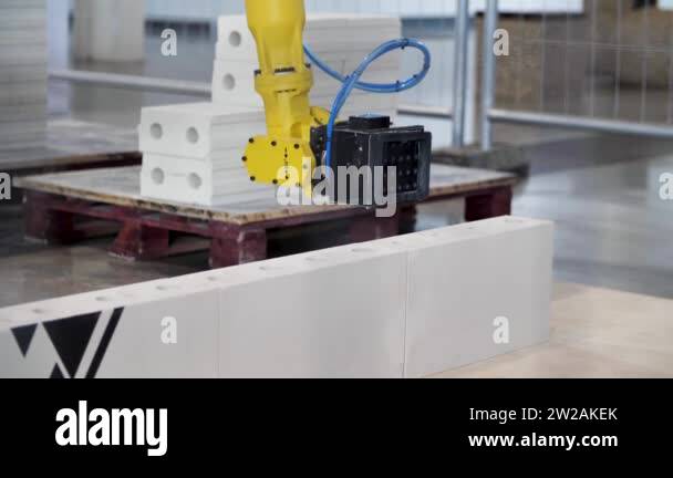 Industrial robot exhibit at work. Media. Bricklayer robot for automated ...