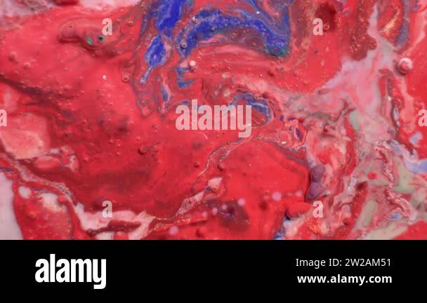 Colorful sparkling paints mix in beautiful patterns. Oil ink of blue ...