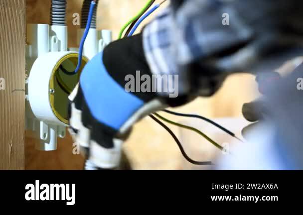 Electrician Arranges Wires In New Outlets And Gets Ready To Install ...