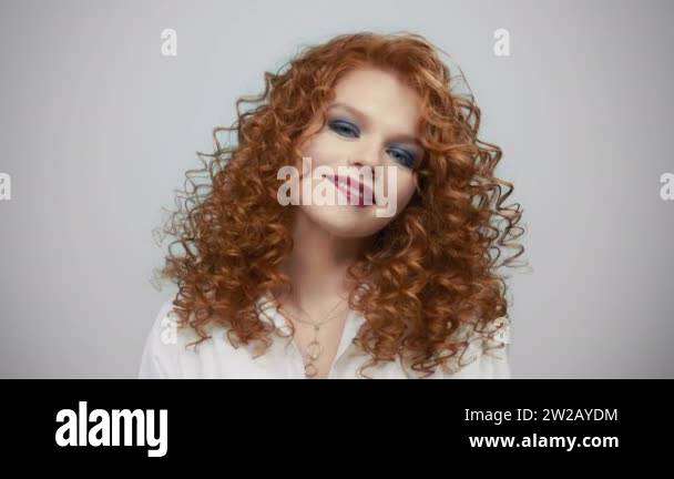 Sexy woman biting lips. Smiling lady flirting with camera. Girl winking ...