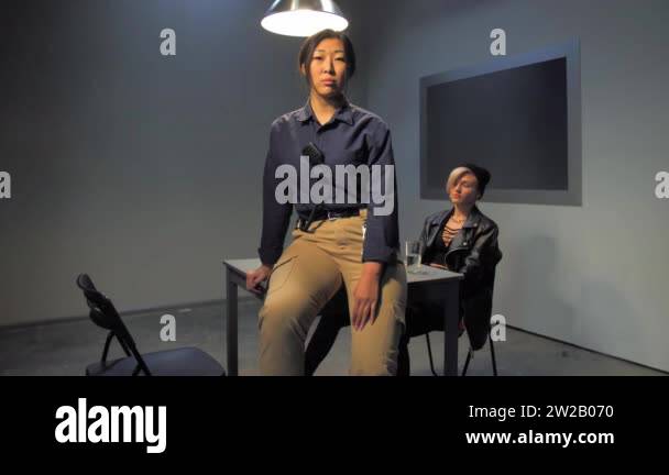 Standing looking at camera arrest police officer Stock Videos & Footage ...