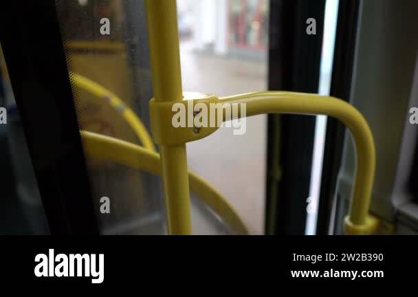The bus doors close and the bus pulls away from the stop. Close-up of ...