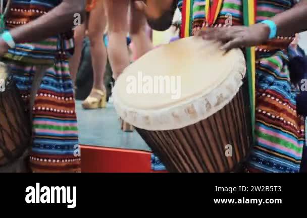 Close-up African s hands playing on djembe drum close up. Musician ...