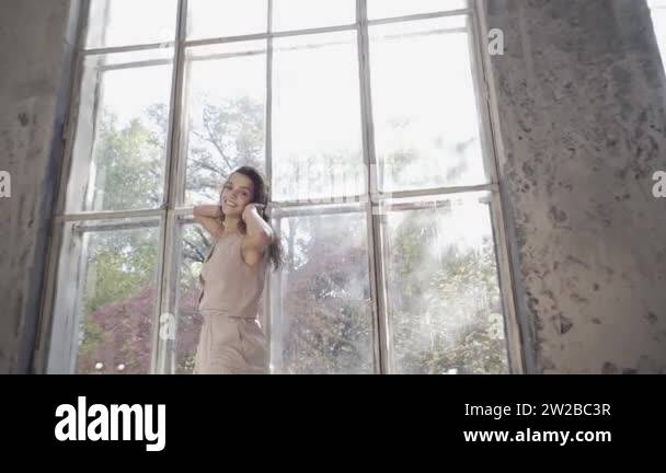 Woman with long hair dancing modern dance. Contemporary freestyle ...