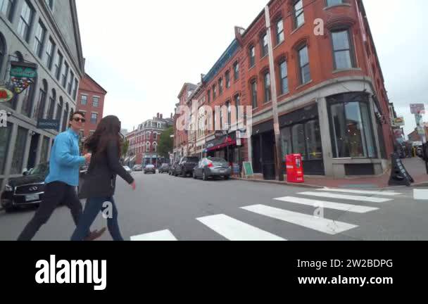 couple exploring downtown portland maine walking city streets shopping ...