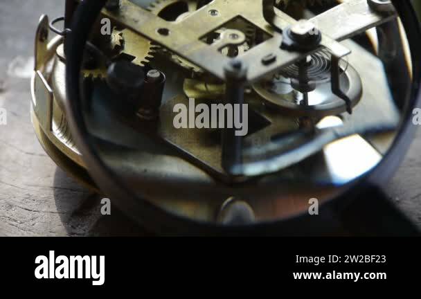 Magnifying glass to enlarge internal structure of Watch,bearings,gears ...